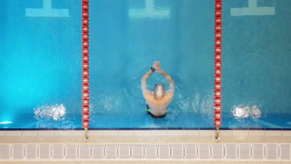 Aerial Drone Top Down View of Professional Swimmer Swimming in the ...