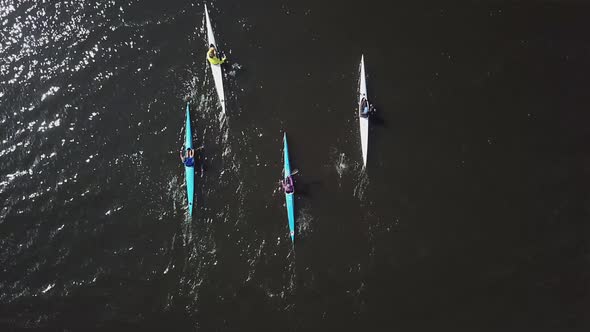 Four Professional Kayakers on Training. Athletes in Kayak Paddling on ...