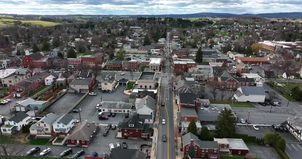 Wide high aerial of homes in small town America. Aerial above street ...