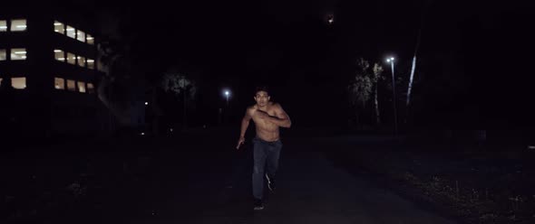 Muscular Man running in the Dark, Stock Footage | VideoHive