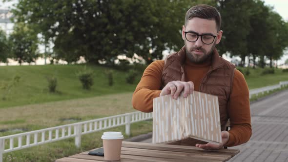 Man Taking Call at Outdoor Table, Stock Footage | VideoHive