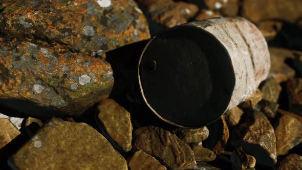 Rusty Destroyed Metal Barrel on Beach Rocks, Motion Graphics | VideoHive