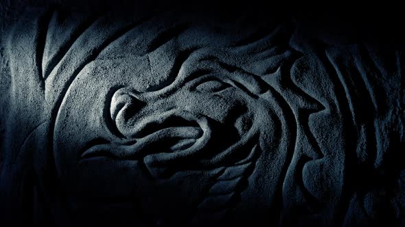 Torch Lights Up Dragon Carving On Cave Wall, Stock Footage | VideoHive