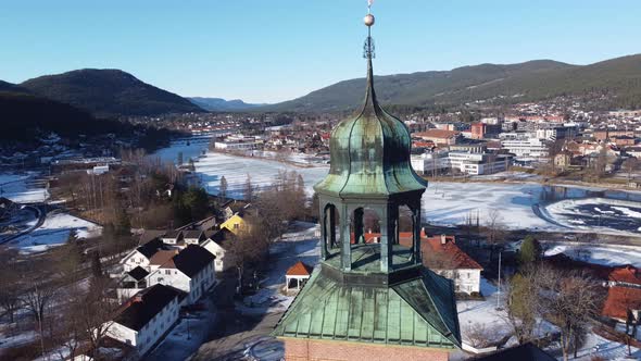 Beautiful winter aerial view of Kongsberg city with top of Church tower ...