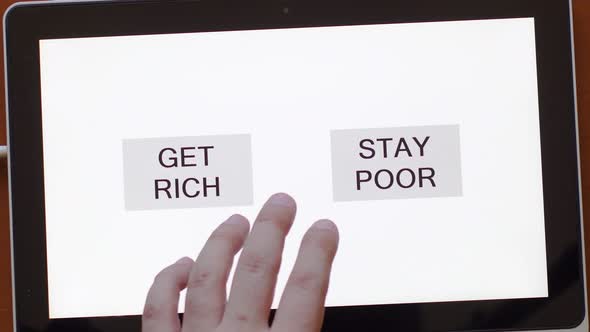 Close-up of a man's hand between the RICH and POOR buttons, Stock Footage