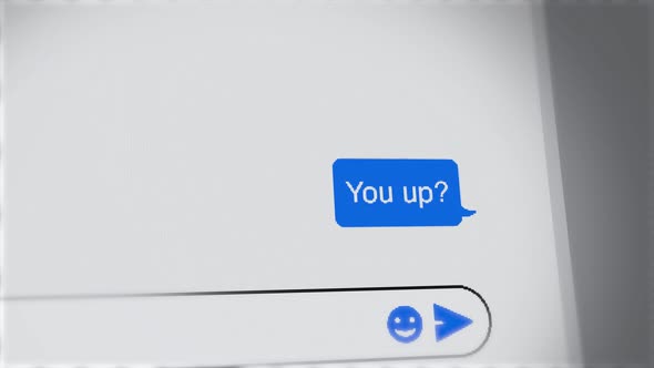 You up - text message close up on screen of chat on phone or computer ...