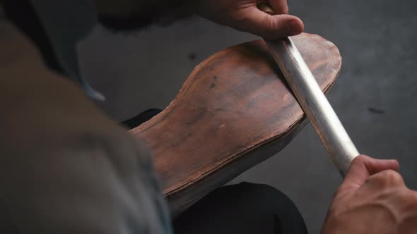 Close Up Shoemaker Polishing Sole Shoe. Shoemaker Sews Shoes. Craft ...