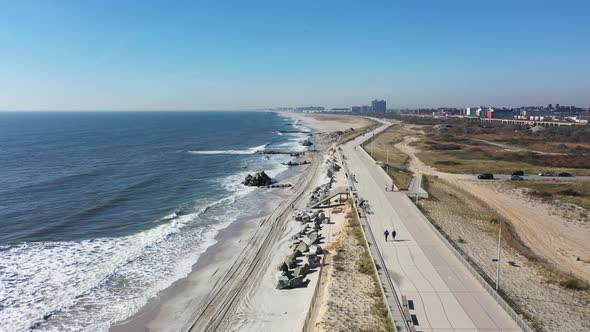 An aerial view of the beach in Far Rockaway, NY. It is a sunny day with ...