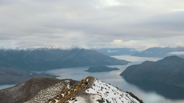 Hiker walking along a ridge line atop of Roys Peak in Wanaka, New ...
