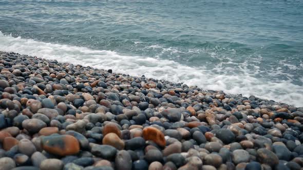 Moving Along Pebble Beach As Waves Come In, Stock Footage | VideoHive