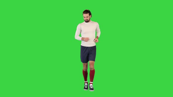 Football Player in Jogging or Running on a Green Screen Chroma Key ...