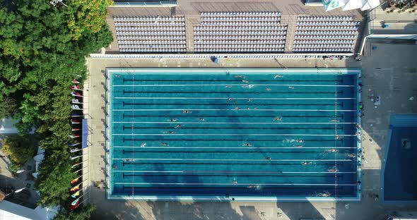 4K top down view of public swimming pool. Professional Swimmer ...