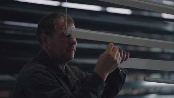 A Factory Worker Screws the Profile and Prepares the Metal for Painting ...