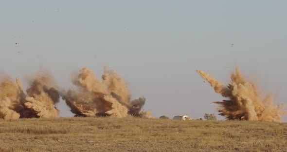 Slow motion of Airstrike with bombs hitting targets with smoke and ...