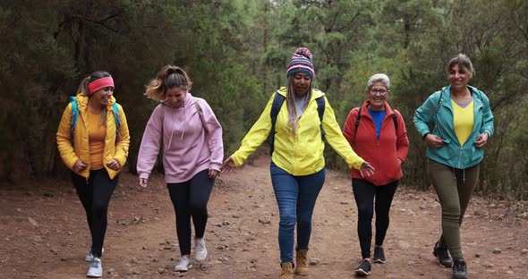 Multi generational women walking outdoor having fun during trekking day ...