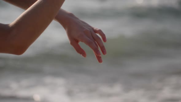 Smooth Movements of the Dancing Girl Hands Against Background of Sea ...