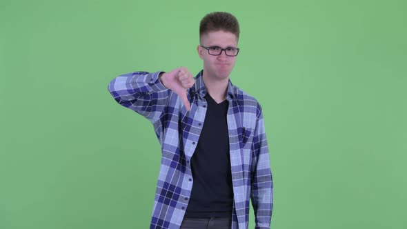 Angry Young Hipster Man Giving Thumbs Down, Stock Footage | VideoHive