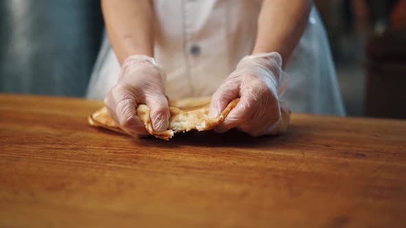 Woman's hands tearing bread from a tandoor, Stock Footage | VideoHive