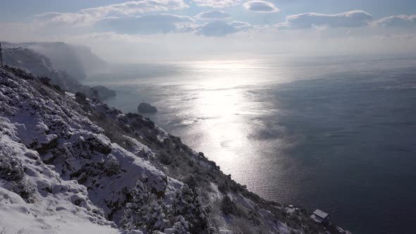 Snow Covered Rocky Cliffs Over Sea, Stock Footage | VideoHive
