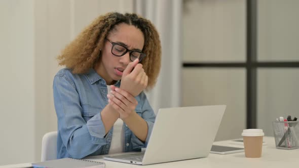 African Woman Having Wrist Pain While Typing on Laptop, Stock Footage