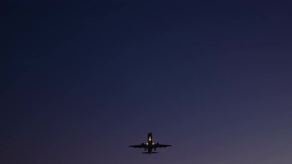 Airplane Flies Over The Camera At Dusk, Stock Footage | VideoHive