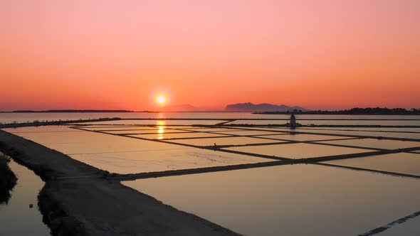 Aerial View of sunset in Saline di Marsala, Salt pans in Sicily, Italy ...