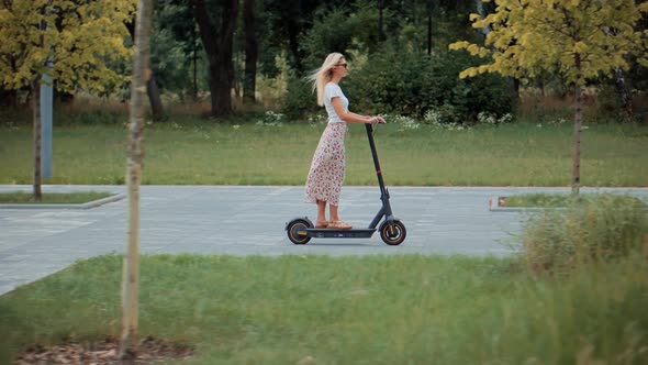 Woman Ride On Electric Scooter Mobility.E-Scooter Rider Rent Personal ...