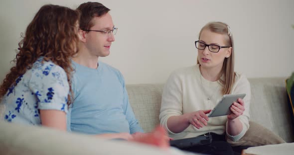 Businesswoman and Young Couple Negotiate Agreement, Stock Footage ...