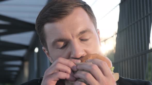 Hungry Office Manager Eating a Tasty Hamburger Close Up, Stock Footage