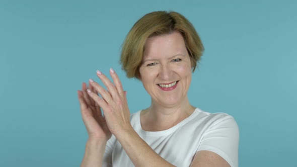 Clapping Old Woman Applauding Isolated on Blue Background, Stock Footage