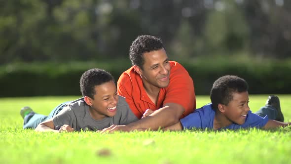 Group portrait of a father and his sons with a football, Stock Footage
