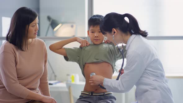 Asian Tween Boy on Health Checkup in Clinic, Stock Footage | VideoHive
