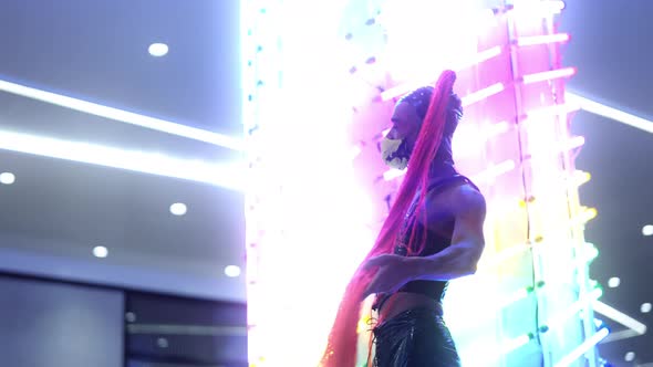 Dancer In Clubwear With Bodice Facemask And Long Ponytail, Stock Footage