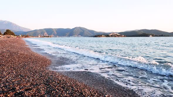 view from Fethiye Calis Beach with small waves and amazing landscape ...