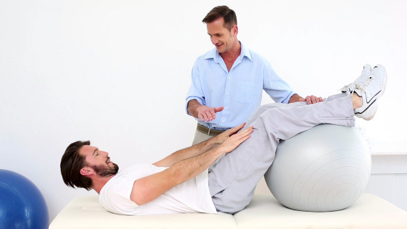 Physical Therapist Helping His Patient Do A Sit Up, Stock Footage ...