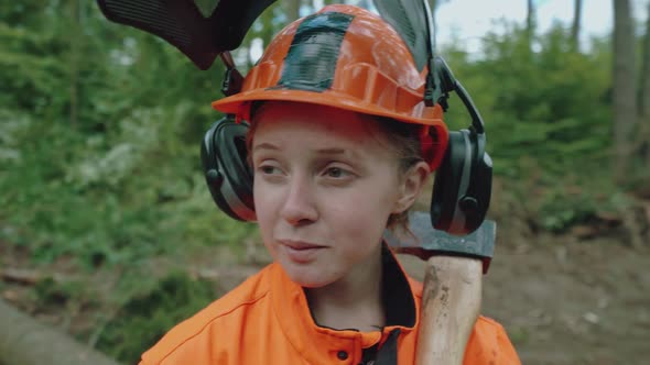 Portrait of a Female Logger Standing in the Forest a Young Specialist ...