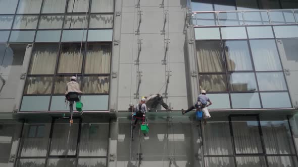 Industrial Window Cleaners at a High Height of the Glass Facade, Stock ...