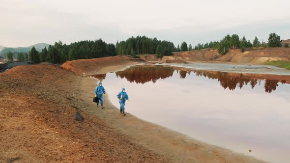 Ecologists Walking Along Contaminated Pond, Stock Footage | VideoHive