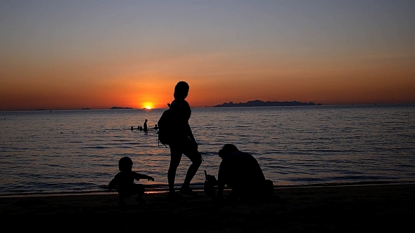 Happy Family near Sea at Sunset, Stock Footage | VideoHive