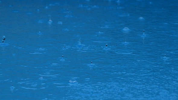 Raining on Blue Pool Water, Stock Footage | VideoHive