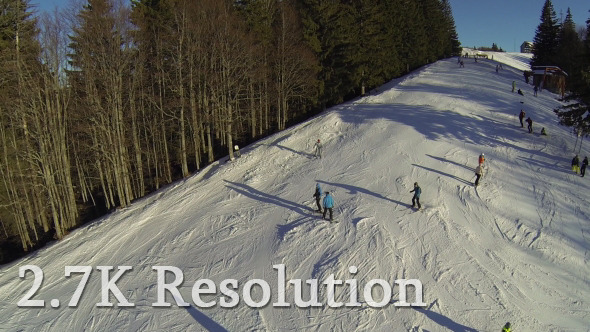 Flying over Skiers on Snowy Slope 4, Stock Footage | VideoHive
