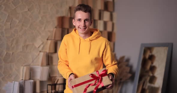 Man Throwing Box with Gift at Camera Congratulate with Birthday Slow ...
