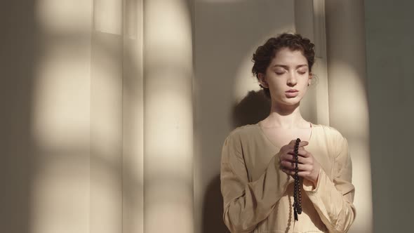 Young Caucasian Woman Praying Heartily, Stock Footage | VideoHive