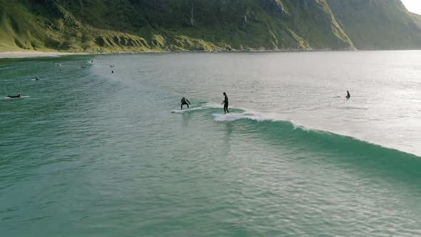Surfers Rising the Waves in Hoddevika, Norway, Stock Footage | VideoHive
