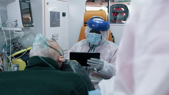 Paramedic Using Tablet Near Coronavirus Patient, Stock Footage | VideoHive