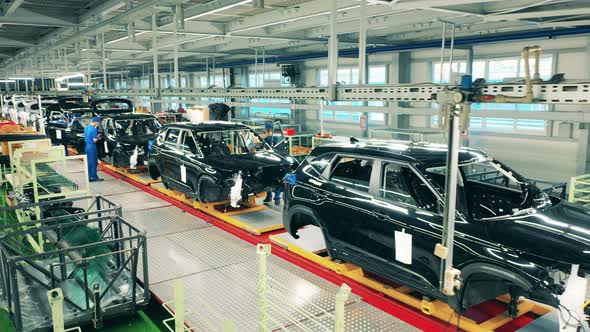 People Working at a Conveyor at Car Factory. Automotive Industry ...