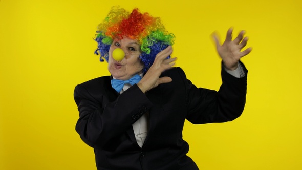 Senior Old Woman Clown in Wig Having Fun, Smiling, Dancing, Making Silly Faces, Stock Footage