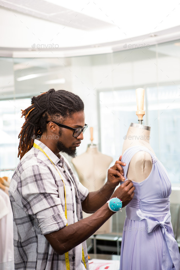 Side view of male fashion designer and mannequin Stock Photo by ...