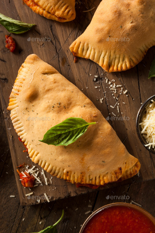 Homemade Italian Meat and Cheese Calzones Stock Photo by bhofack2 ...