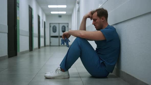 Stressed Surgeon Staying Clinic Hallway After Operation, Stock Footage